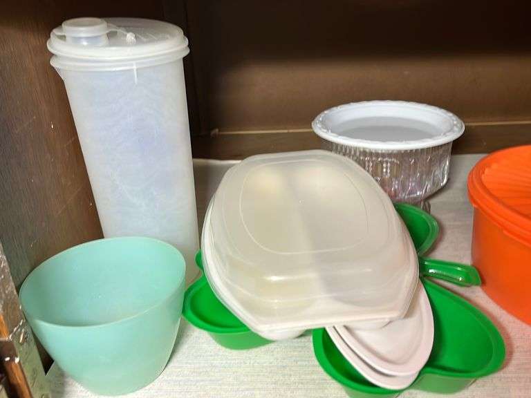 Plasticware including Tupperware, contents of cabinet as shown in ...