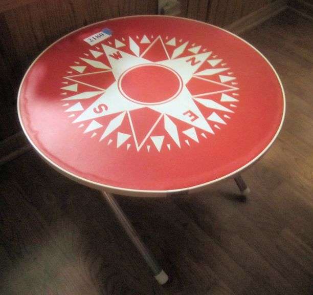 Folding red compass side table - Mark Van Hook, Auctioneer