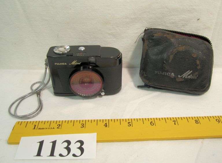 Fujica Mini half-frame 35mm compact camera - Mark Van Hook, Auctioneer