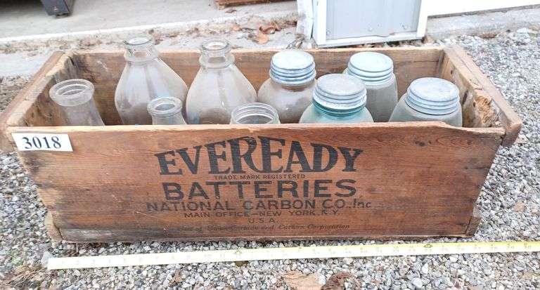 Antique wood Eveready battery crate full of milk and canning bottles ...