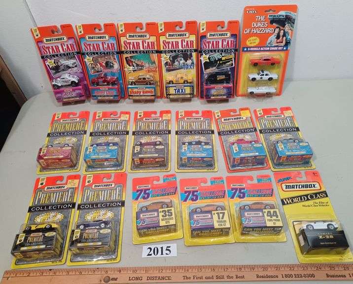 Matchbox cars in packages - Mark Van Hook, Auctioneer