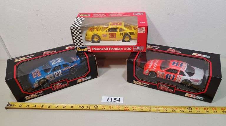 (3) NASCAR diecast cars in Packaging - Mark Van Hook, Auctioneer
