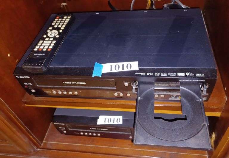 Two Magnavox dvd/vhs decks with one remote - Mark Van Hook, Auctioneer