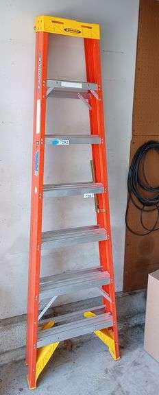Werner 7 ft orange fiberglass step ladder. - Mark Van Hook, Auctioneer