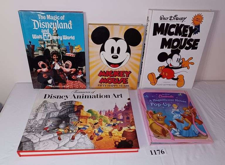 Five Disney books, and a newspaper from the opening of Disney World ...