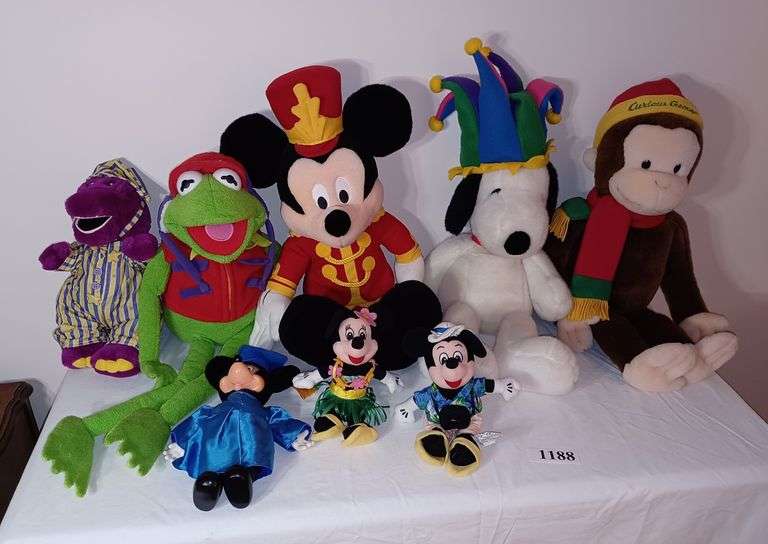 Plush animals including Mickey Mouse, Curious George, Snoopy, Kermit ...
