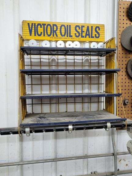 Victor Oil Seals Metal Rack - Ness Bros Realtors & Auctioneers