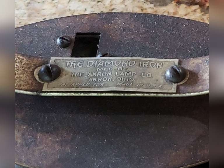 The Diamond Iron Akron Lamp Co. Liquid fueled iron with fuel siphon pump.