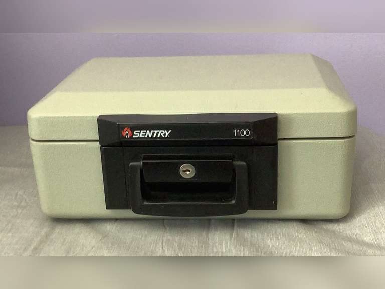 Sentry 1100 insulated filing device with key. Measures approximately 14 ...
