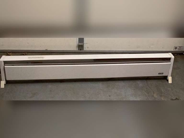 Baseboard 110V plug in electric heater. Measures approximately 5’ in ...