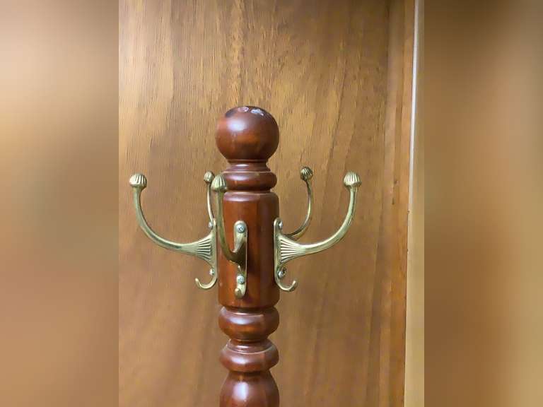 Hall tree 66 inches tall. One of the legs is loose.