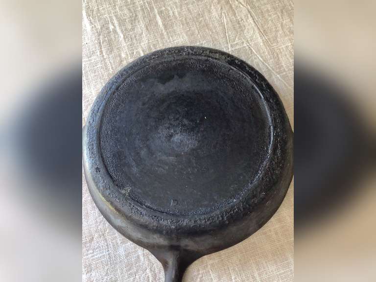 Cast iron skillet with number eight on the handle. Has heat ring and 2 ...