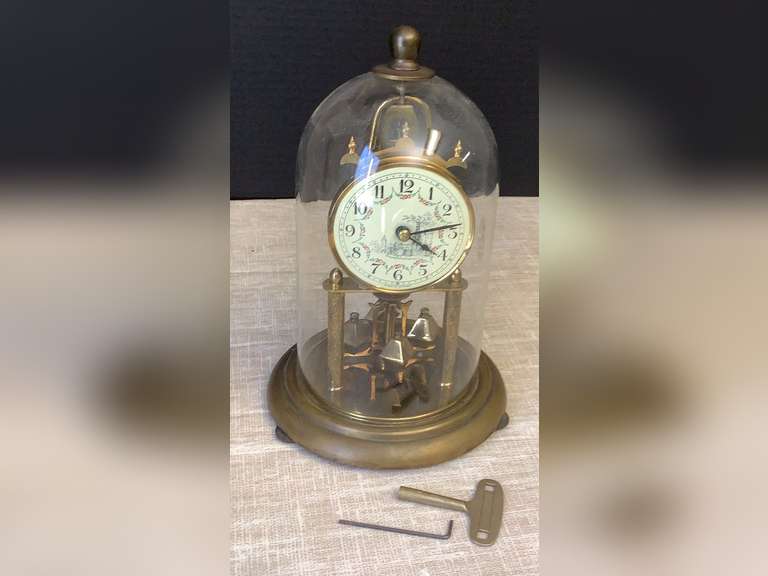 10” Domed clock with key. Needs repaired. - Northern Kentucky Auction, LLC