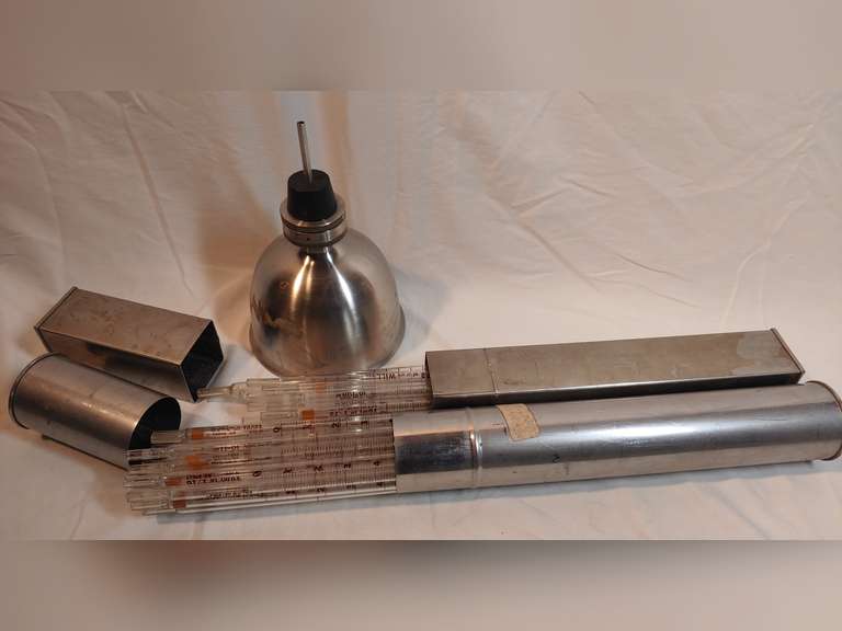 Lab pipettes in metal storage containers and Metal Lab funnel ...