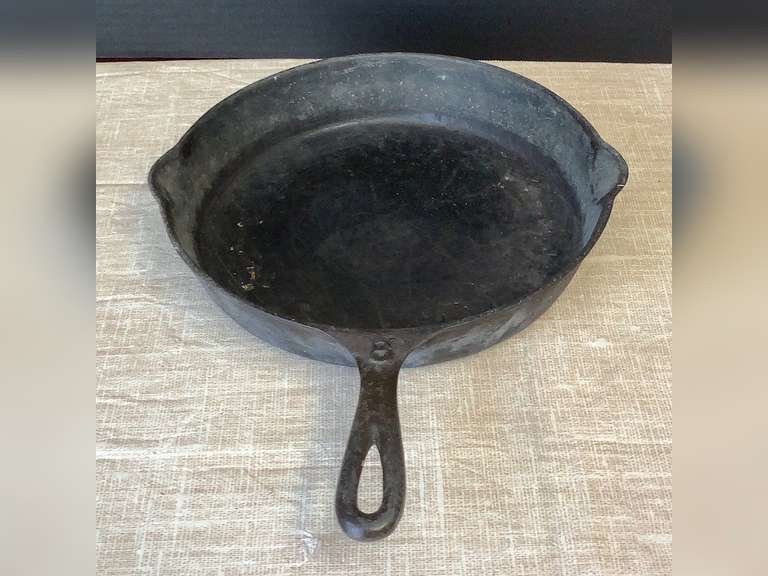 Cast iron skillet with number eight on the handle. Has heat ring and 2 ...