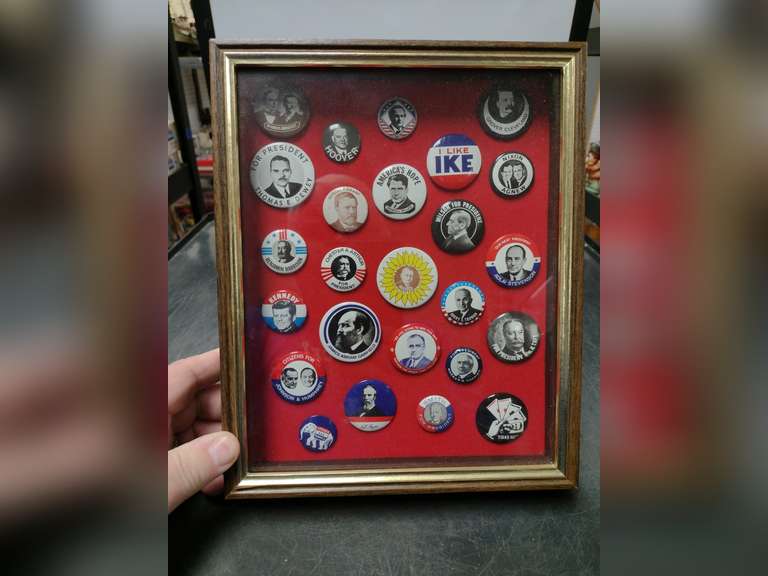 Political pinback buttons in display case.