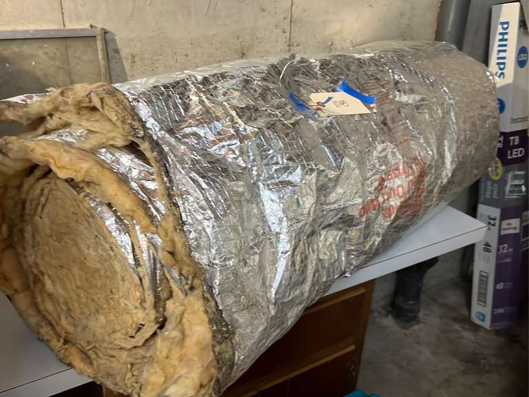 Partial roll of fiberglass batt insulation with foil coating - Northern ...