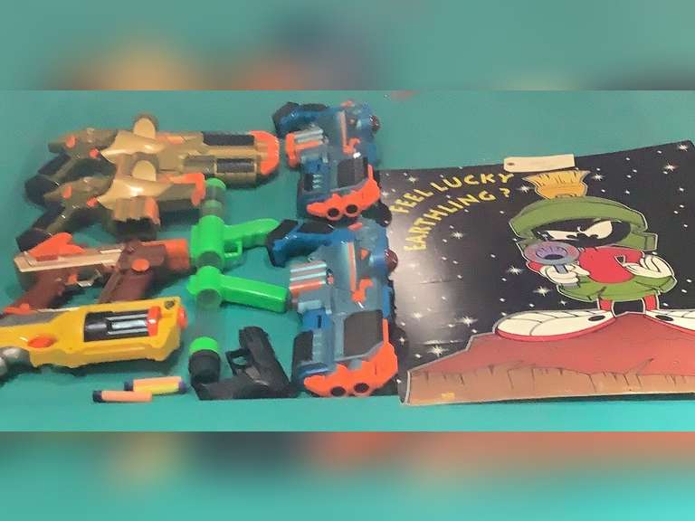 Toy guns and 28” x 22” Disney Poster. - Northern Kentucky Auction, LLC