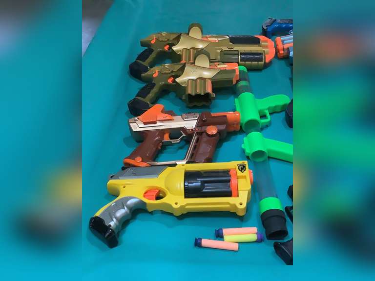 Toy guns and 28” x 22” Disney Poster. - Northern Kentucky Auction, LLC