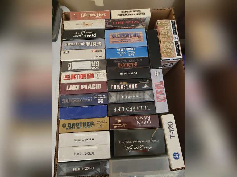 Variety of classic VHS tapes and an 8 track storage drawer - Northern ...