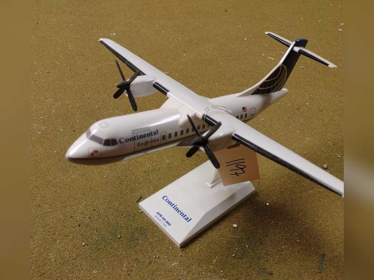 Continental ATR 42-300 prop plane with stand.
