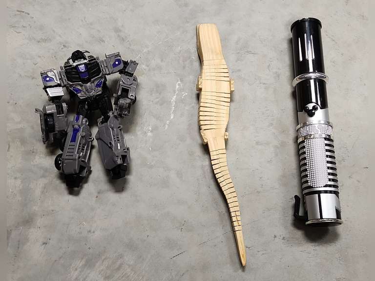 Assorted toys - Transformers, wood alligator & Mickey Mouse lightsaber