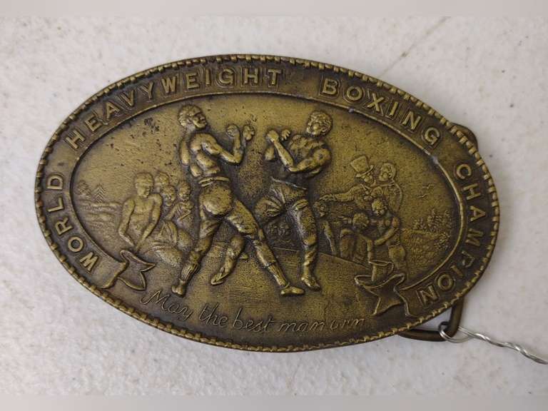 World Heavyweight Boxing Champion belt buckle.