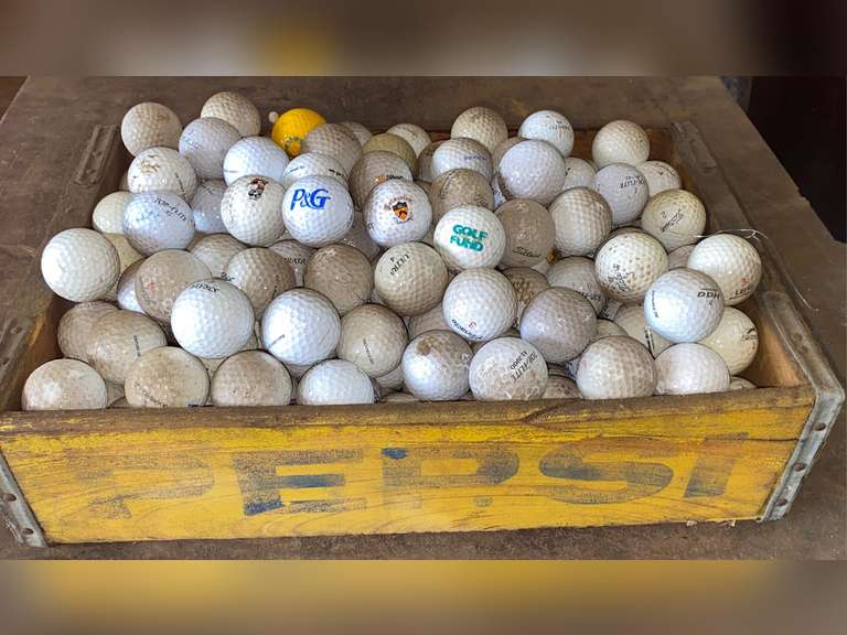 Pepsi crate, full of golf balls - Northern Kentucky Auction, LLC