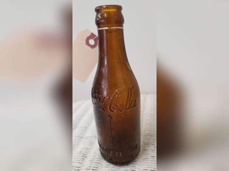 Amber Coca-Cola bottle. Cincinnati, Oh - Northern Kentucky Auction, LLC
