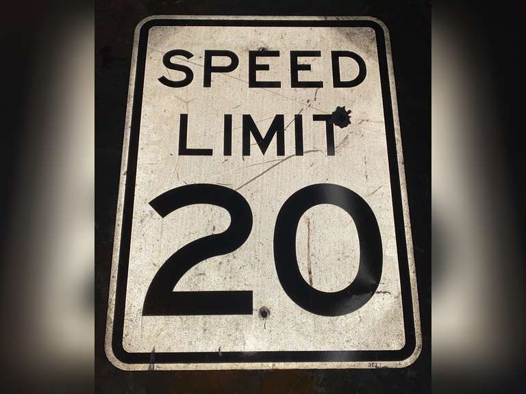 Speed limit sign with fake bullet hole - Northern Kentucky Auction, LLC