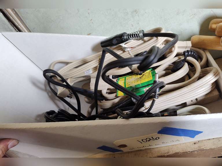 Shelf clean out. Electrical cords, 12 concrete trowels, masking tape ...