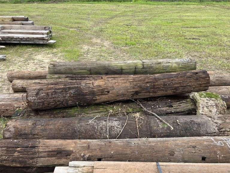 11 Creosote Poles - Nutt Auction