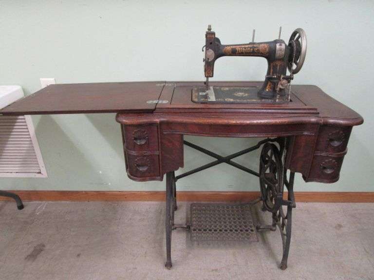 White Oak Cased Treadle Sewing Machine - Oberman Auctions