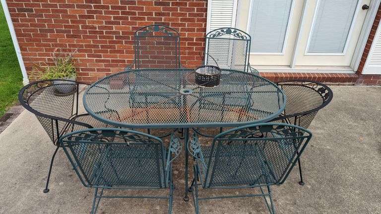 Oval expanded metal patio table with 4 springer chairs and 2 straight ...