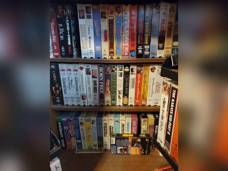 2 door storage cabinet with VHS tapes - Parrott Marketing Group