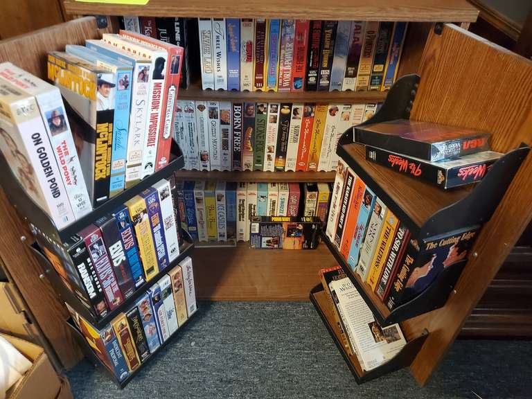 2 door storage cabinet with VHS tapes - Parrott Marketing Group