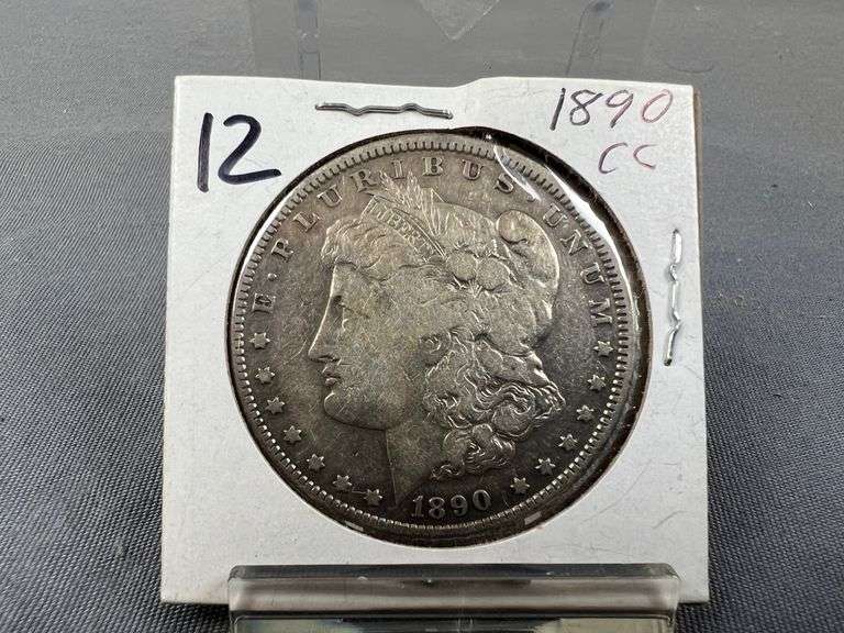 1890 "CC" MORGAN SILVER DOLLAR - Peterson Land & Auction LLC