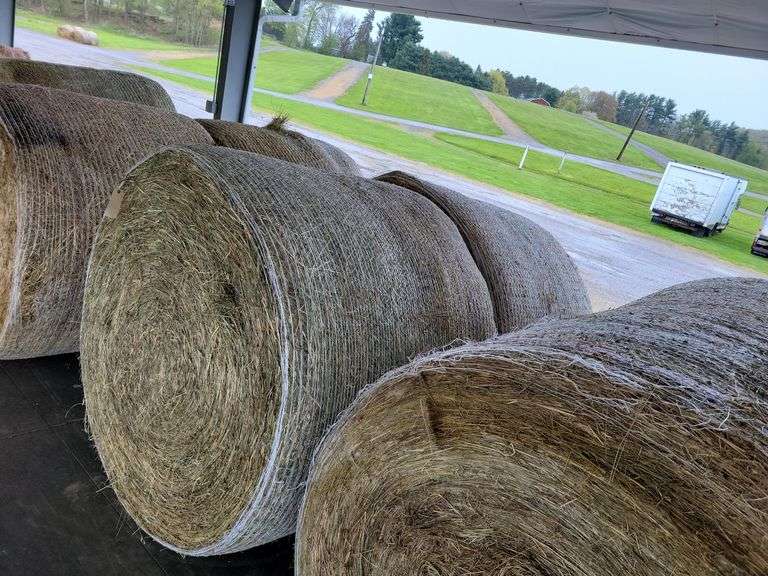 2 Round Bales 1st Grass (4x5) Stored Inside - Rogers Community Auction Inc.