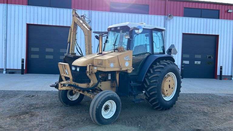 New Holland TS110 2WD Tractor w/ Side Boom Mower - RES Auction Services