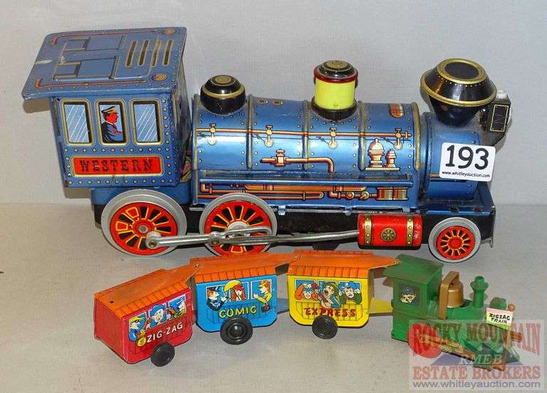 2 Vintage Tin Trains. The larger train body is loose from the base ...