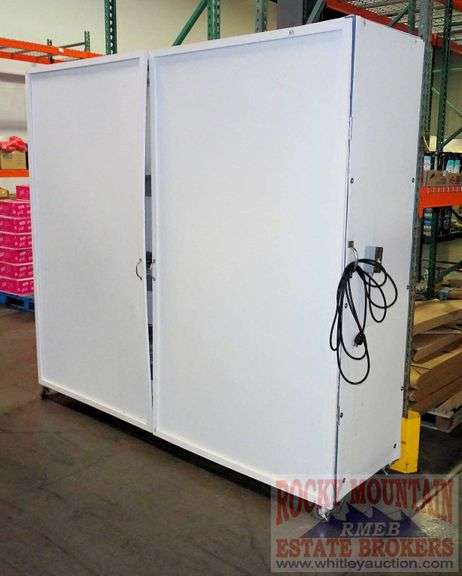 Uline heavy duty adjustable shelving unit on wheels enclosed in ...