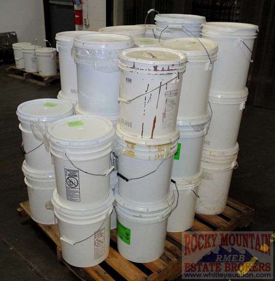 Assorted white buckets full of assorted honey, sesame & other ...