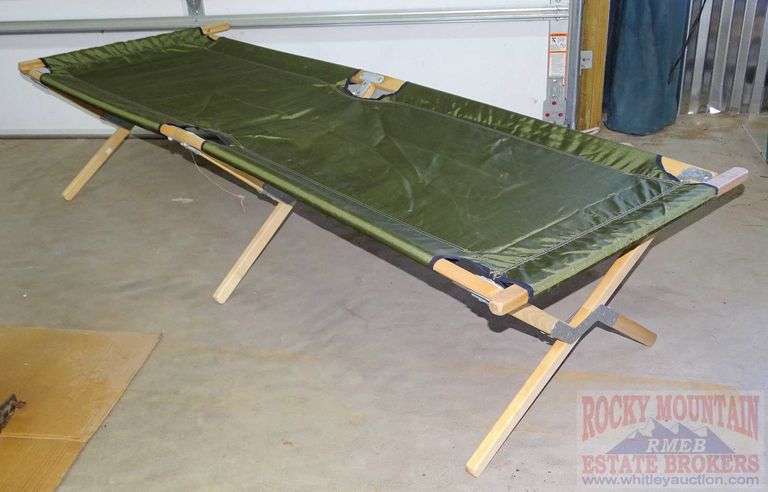 Wooden Canvas folding cot. - Rocky Mountain Estate Brokers Inc.