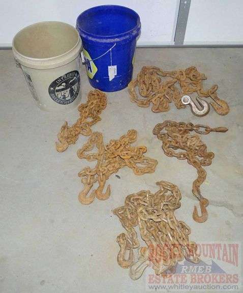 Assorted large chains with hooks in two 5-gallon buckets. All for one ...