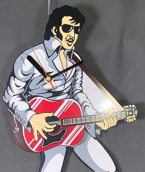 Neat new, "Elvis" swinging legs clock. - Rocky Mountain Estate Brokers Inc.