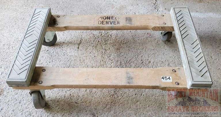 Heavy duty wooden 4-wheel dolly. - Rocky Mountain Estate Brokers Inc.