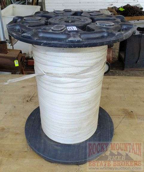 Partial spool of mule tape - nylon webbing. Spool is 19" high. There is ...