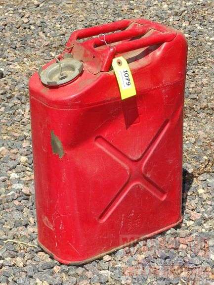Red Jerry can, dented. - Rocky Mountain Estate Brokers Inc.