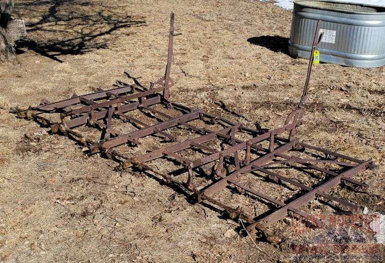 Vintage 8' spike tooth drag harrow. - Rocky Mountain Estate Brokers Inc.