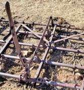 Vintage 8' spike tooth drag harrow. - Rocky Mountain Estate Brokers Inc.